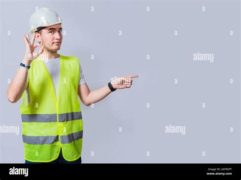 Handsome Engineer Recommending A Product On White Background Young