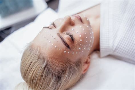 A Young Attractive Blonde Was Put Cream On Her Face Stock Image Image