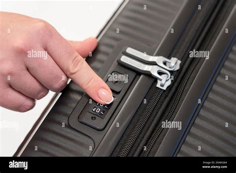 Selecting The Numbers On The Combination Lock Of The Suitcase With Your Finger To Open It Stock