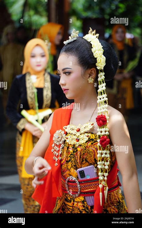 Indonesian With A Traditional Javanese Cloth On 1800 Chocolate Ketupat