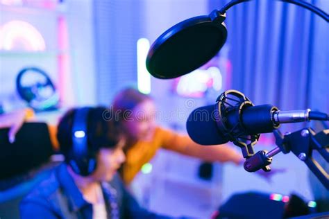 Close Up Professional Microphone With Filter With Blur Teenager Man And