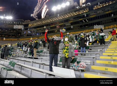 A Limited Number Of Fans Watch During The National Anthem Before An Nfl