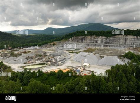 aerial view of open pit mining site of limestone materials extraction