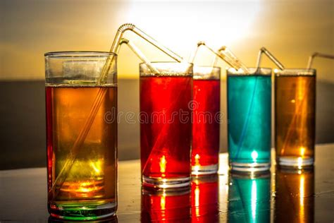 Cooling Summer Drink Concept Cocktail Glasses Splashing On Sunset