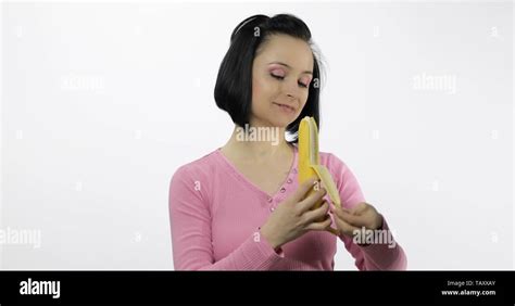 Young Beautiful Woman Peeling A Big Banana Healthy Nutrition Stock