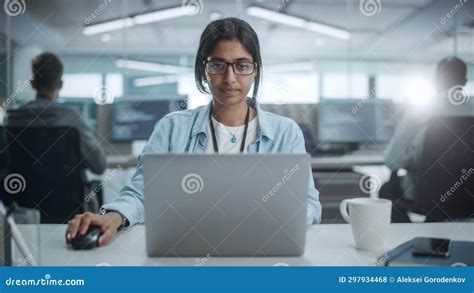 Diverse Office Portrait Of Smiling Indian It Programmer Working On