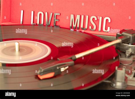 Close Up To A Turn Table Needle Playing A Lp Vinyl Disc With Turn Table