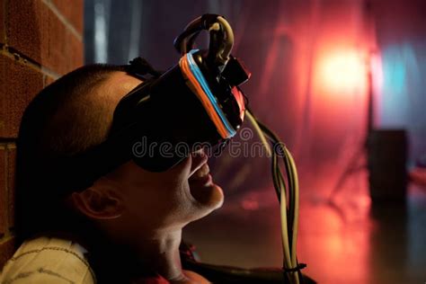 Happy Cyberpunk Girl With Cyber Reality Headset Sitting In Hacker