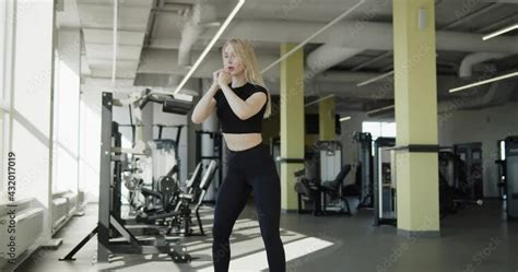 Young Active Sporty Blonde Girl Trains In The Gym Athletic