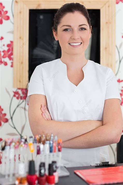 Selfassured Lady At The Reception Desk Of A Nail Spa With Crossed Arms