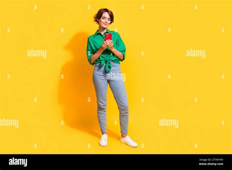 Full Length Photo Of Pretty Shiny Girl Dressed Green Shirt Texting