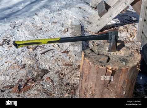 Axe Stuck On A Log Stock Photo Alamy