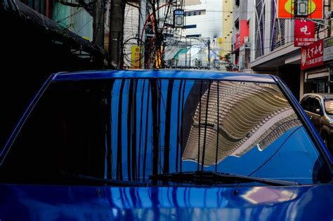 Premium Photo Reflection Of Building On Car