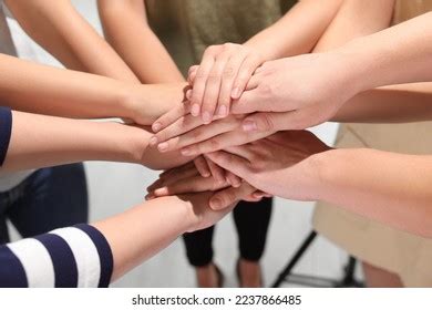 Group People Holding Hands Together Indoors Stock Photo 2237866485