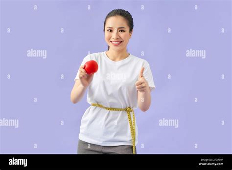Healthy Female Body With Apple And Measuring Tape Stock Photo Alamy