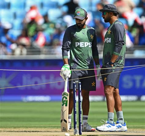 Babar Azam And Haris Rauf Peer At The Pitch