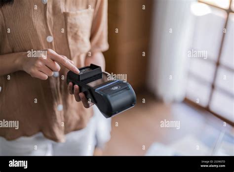 Contactless Payment Holding Credit Card With Touch Settlement Paying For Shopping Nfc Technology