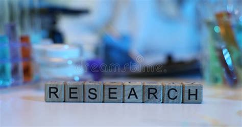 Word Research On Laboratory Table With Working Scientist Stock Footage