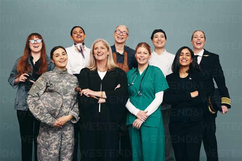 Successful Women From Different Professions Standing Together Their Occupational Attires