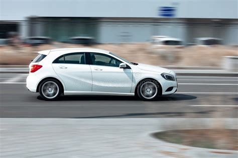 Side View Rolling Shot With White Car In Motion Mercedes A Class W176
