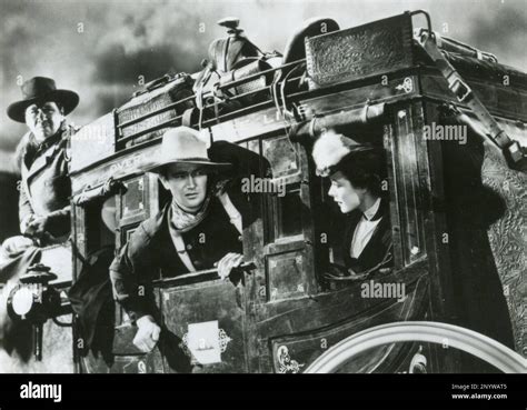 American Actor John Wayne And Actress Louise Platt In The Movie