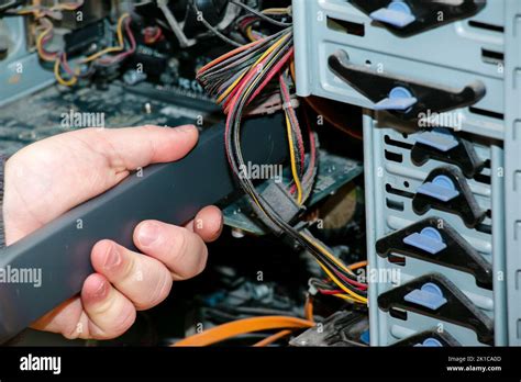 Cleaning The System Unit Of A Desktop Computer From Dust Using A Vacuum