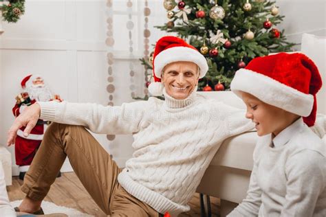 Grandfather And Grandson In Santa Hats Stock Photo Image Of Happiness Beauty