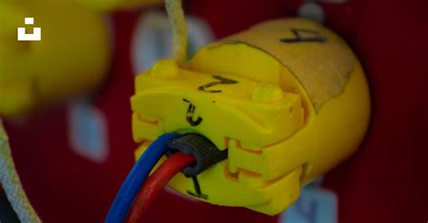 A Close Up Of A Yellow And Blue Electrical Wire Photo Free
