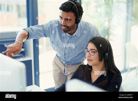 Resolving Issues For Their Clients Together Two Call Centre Agents