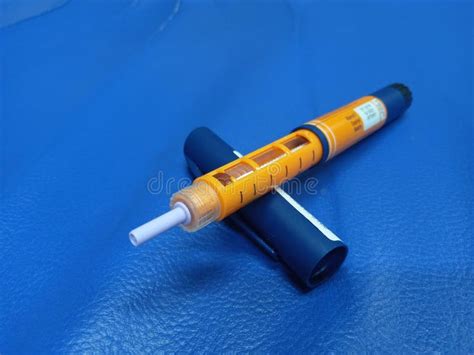 Close Up Photo Blue And Green Insulin Pen At White Background Stock
