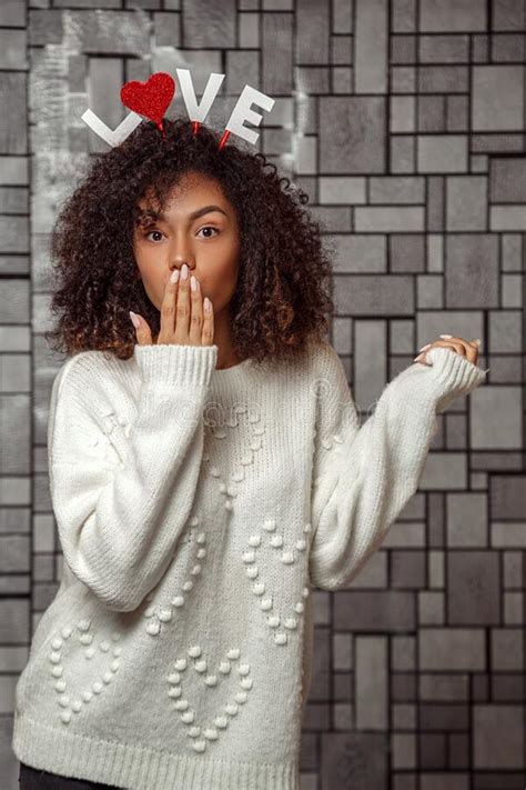 Close Up Portrait Of A Young Curly Haired African American Girl In A