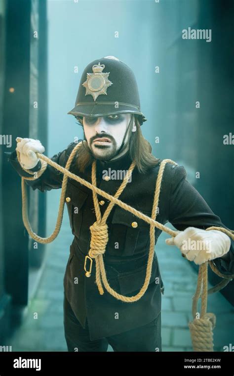 A Portrait Of A Male Cosplayer At A Comic Con Event In A Scary British