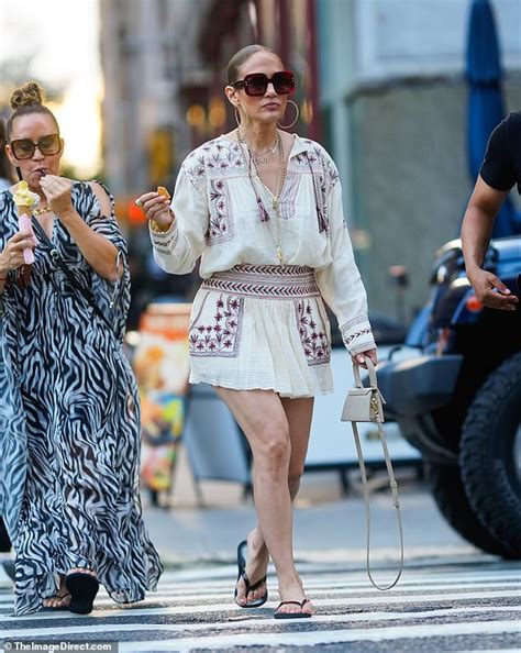 Jennifer Lopez Wears A Patterned Mini Dress With Flip Flops For
