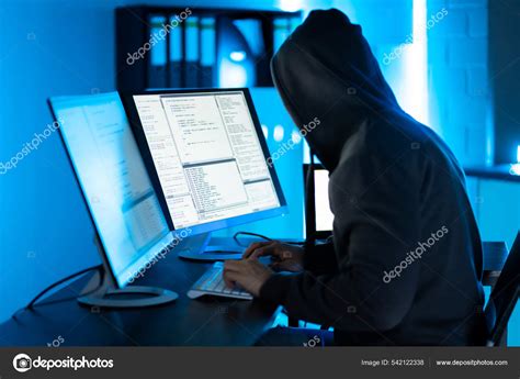 hacker using computer write cyber security exploit software program
