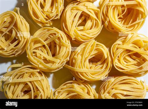 Uncooked Egg Based Fettuccine Pasta A Culinary Canvas Of Ribbon Shaped