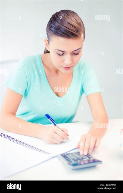 Babe Girl With Notebook And Calculator Stock Photo Alamy