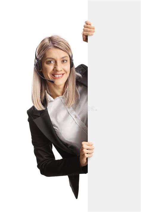 Female Dispatch Worker With A Headset Standing Behind A Blank White
