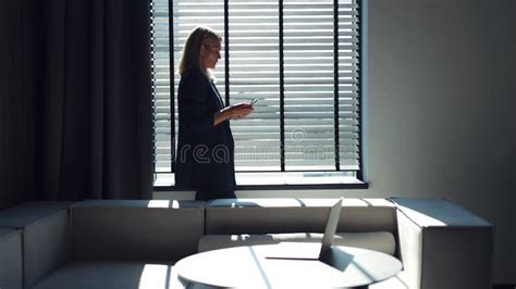 Successful Caucasian Woman In Business Suit Counting Money Cash At Dark