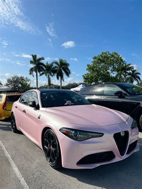 Pink Alfa Coupe In A Parking Lot