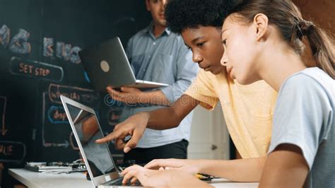 Girl Programing Or Coding System While African Boy Fixing Model