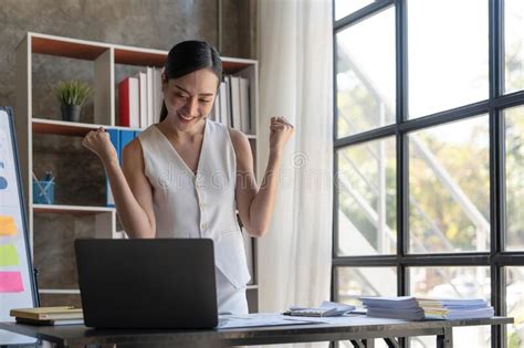 Pretty Asian Businesswoman Sitting On A Laptop And The Work Came Out
