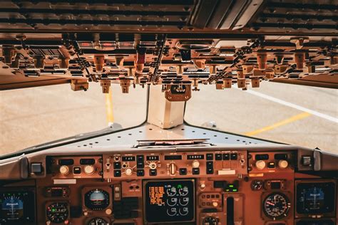 The Cockpit Of An Airplane With Multiple Controls Photo Free Cockpit