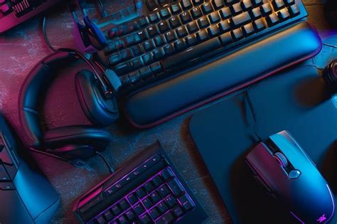 Premium Photo A Keyboard Mouse And Headphones On A Desk