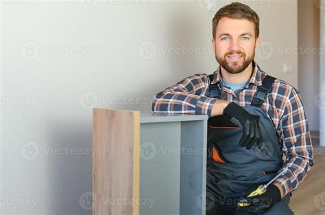 Professional Furniture Assembly Worker Assembles Shelf Professional