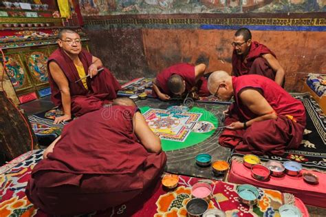 Buddhist Monks Creating Traditional Sand Mandala Inside Tibetan