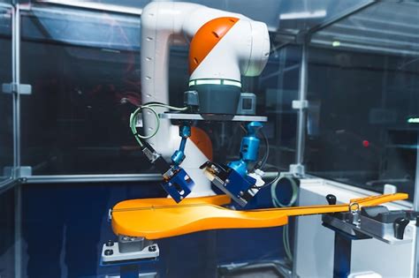 Premium Photo Checking The Guitar Robot Arm Working On The Yellow