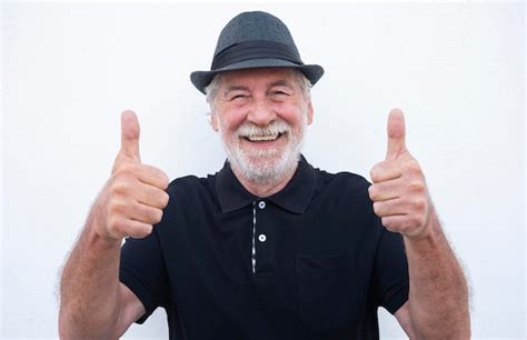 Premium Photo Portrait Of Smiling Man Standing Against Gray Background