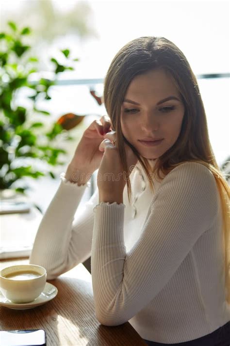 Beautiful Woman Sitting And Dreaming About Something In Cafe Coffee