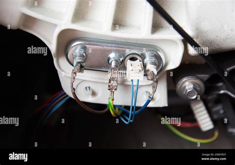 An Electric Heating Element With A Thermostat Is Connected With