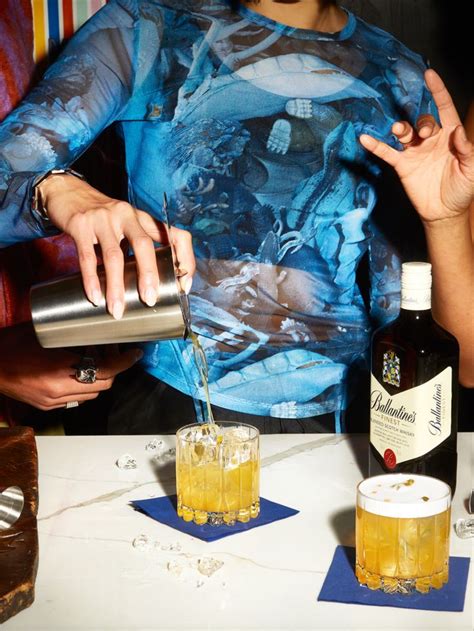 An Image Showing Someone Mixing Up And Pouring A Ballantines Finest